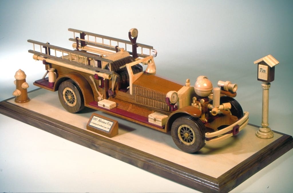 1827 Firetruck in wood. Great for the firestation or home.